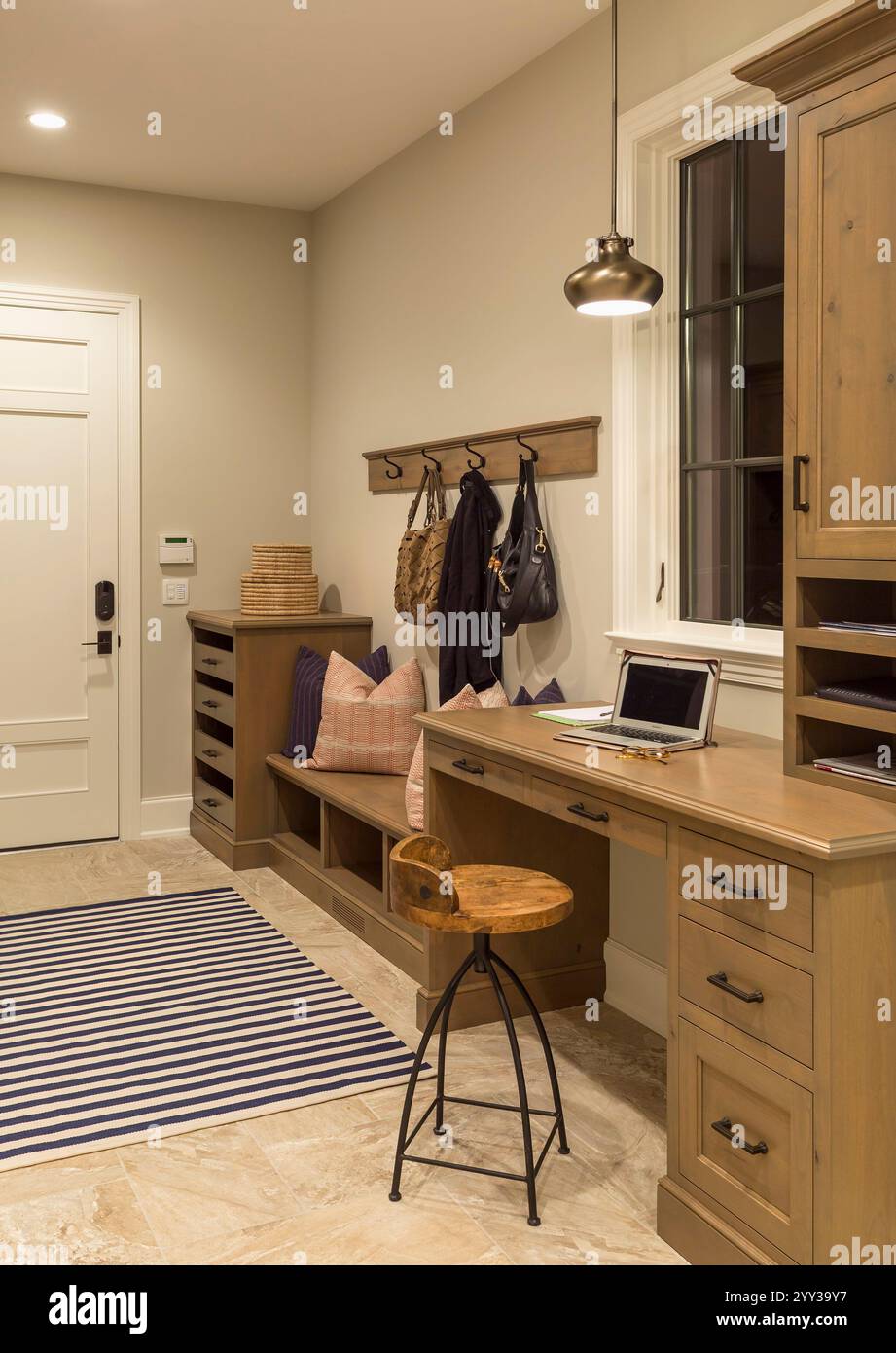 Back hallway of house with desk and storage and mudroom area Stock ...