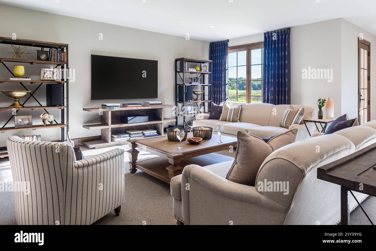 Sunny family room on lower level of house with neutral colors Stock ...