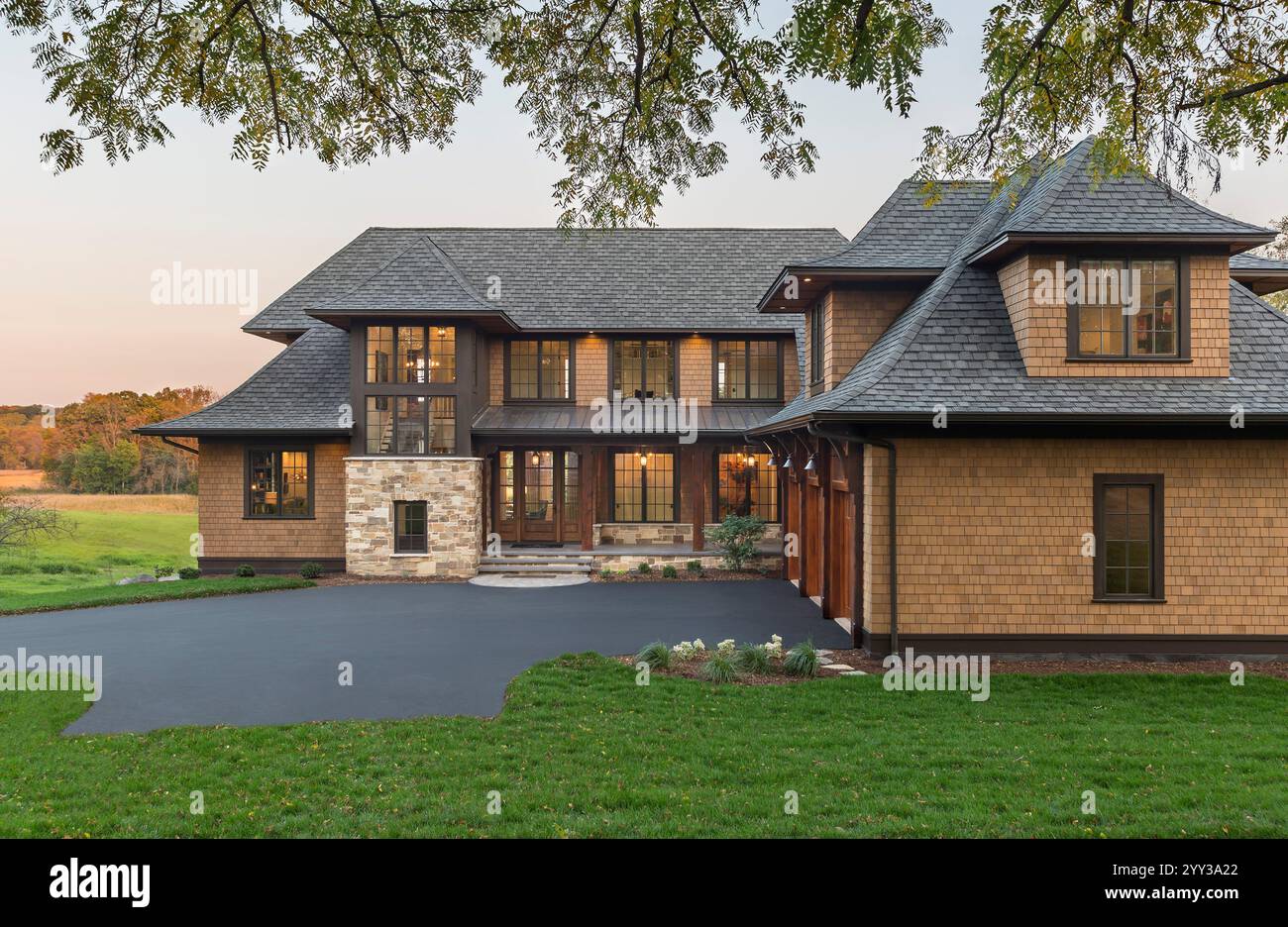 Large shingle style house surrounded by beautiful countryside Stock ...