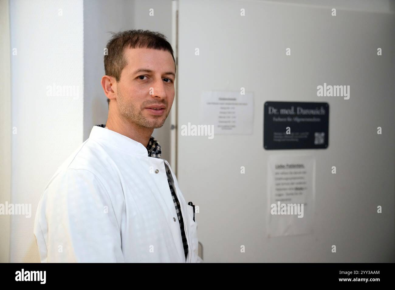 Syrian doctor Ayham Darouich, 40, attends an interview with the ...
