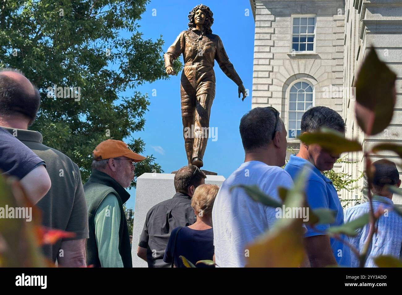 A crowd surrounds the newly-unveiled statue of Christa McAuliffe, NASA ...