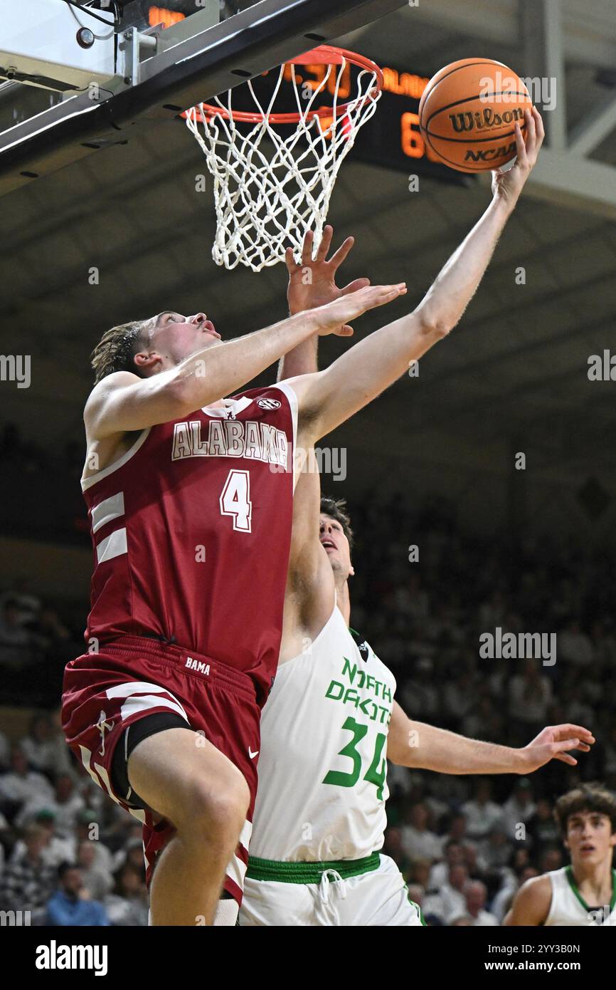 Alabama's Grant Nelson (4) heads to the basket past North Dakota's ...