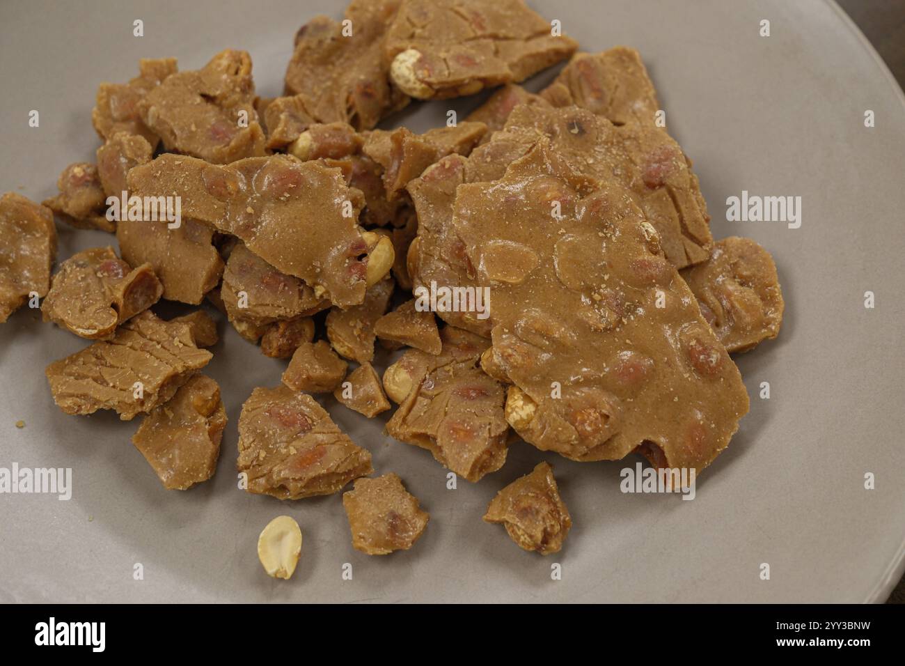Peanut Brittle candy snack ready to eat Stock Photo - Alamy