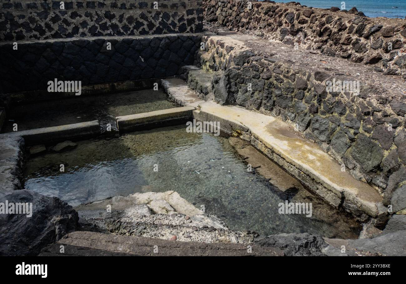 Traditional bathing pool along the Jeju Olle Trail in rural Jeju Island ...
