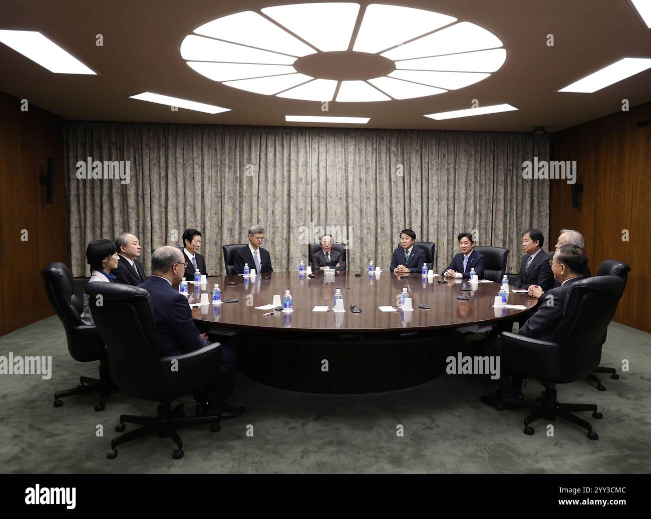 Bank of Japan Governor Kazuo Ueda(C) attends the BOJ's monetary policy ...