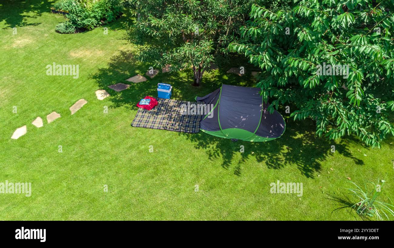 Aerial top view of campsite from above, tent and camping equipment ...