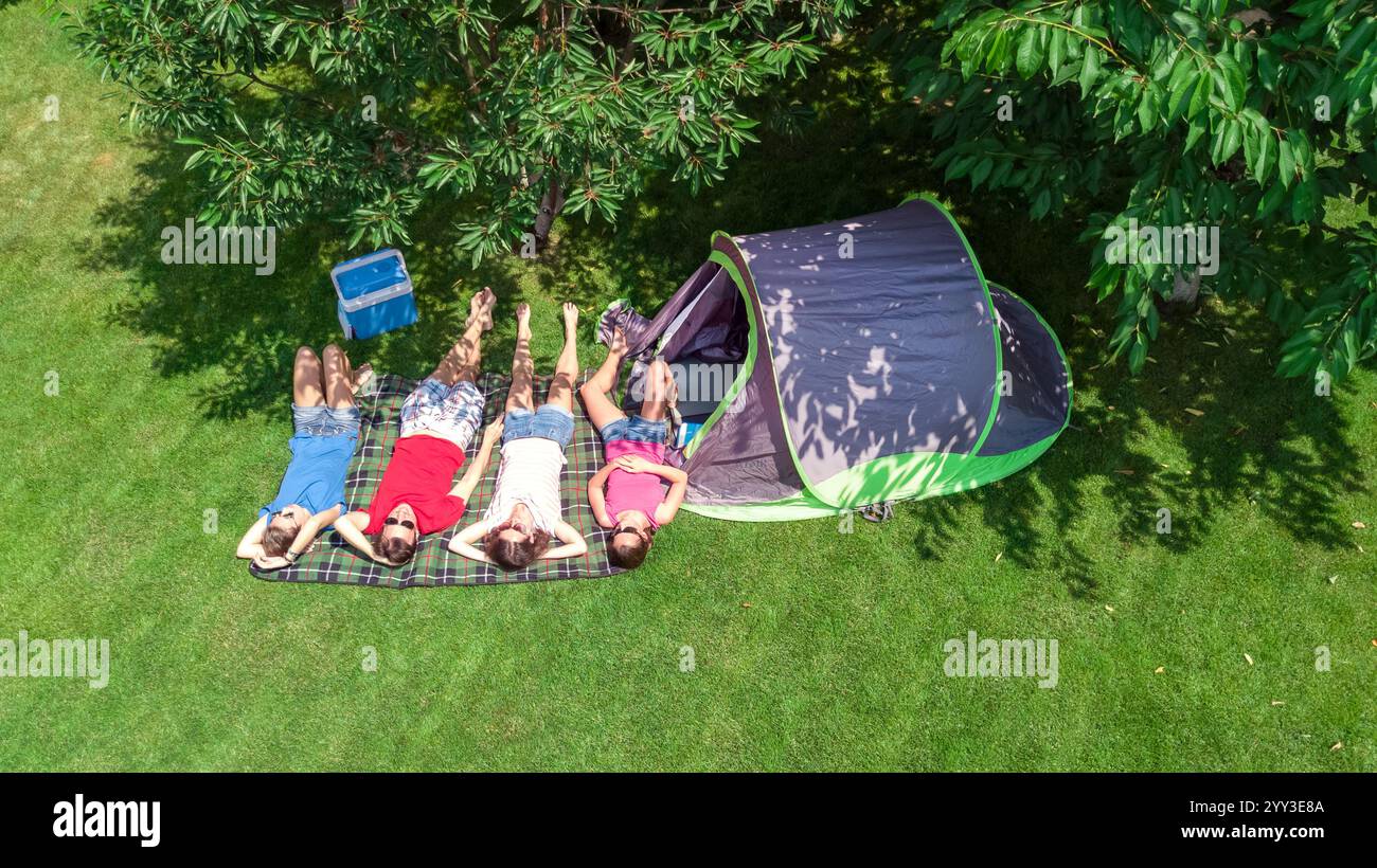 Family vacation in campsite aerial top view from above, parents and ...
