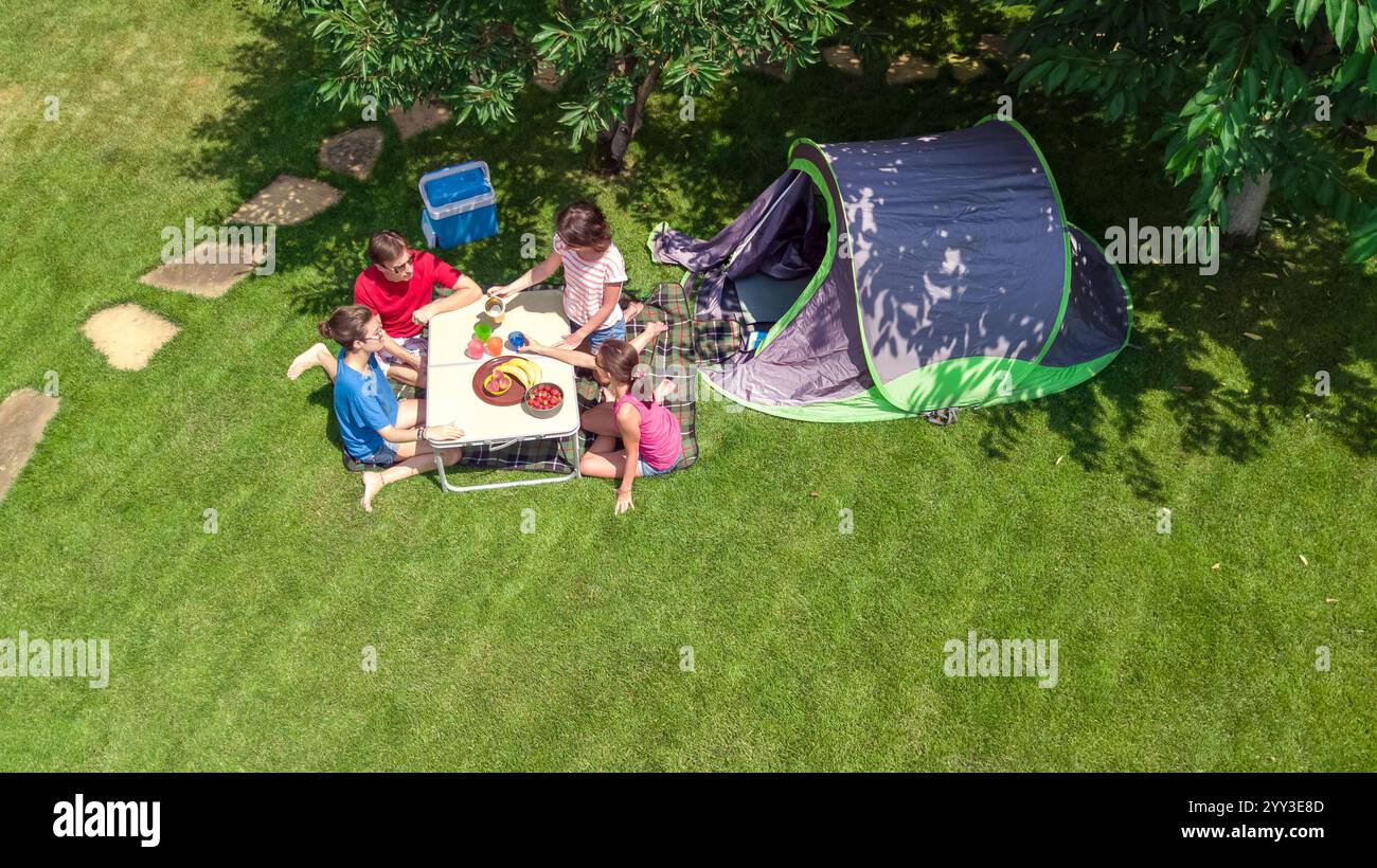 Family vacation in campsite aerial top view from above, parents and ...