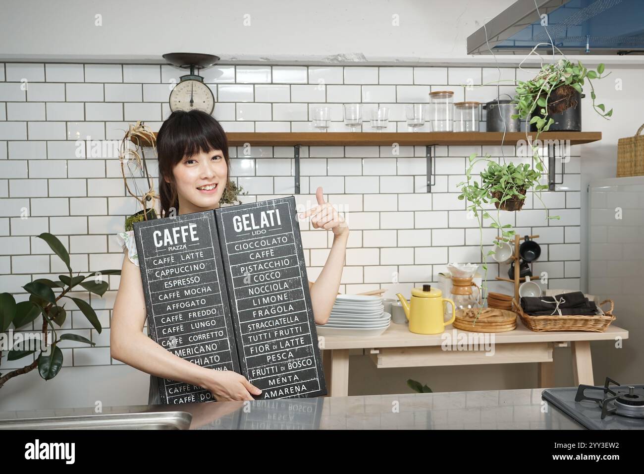 Cafe staff making coffee Stock Photo - Alamy