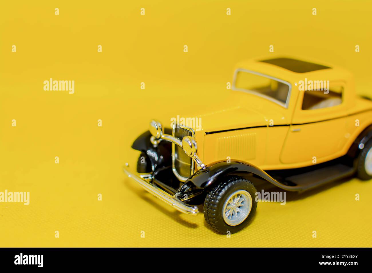 Retro car from the side. Beautiful classic yellow car. Nice antique ...
