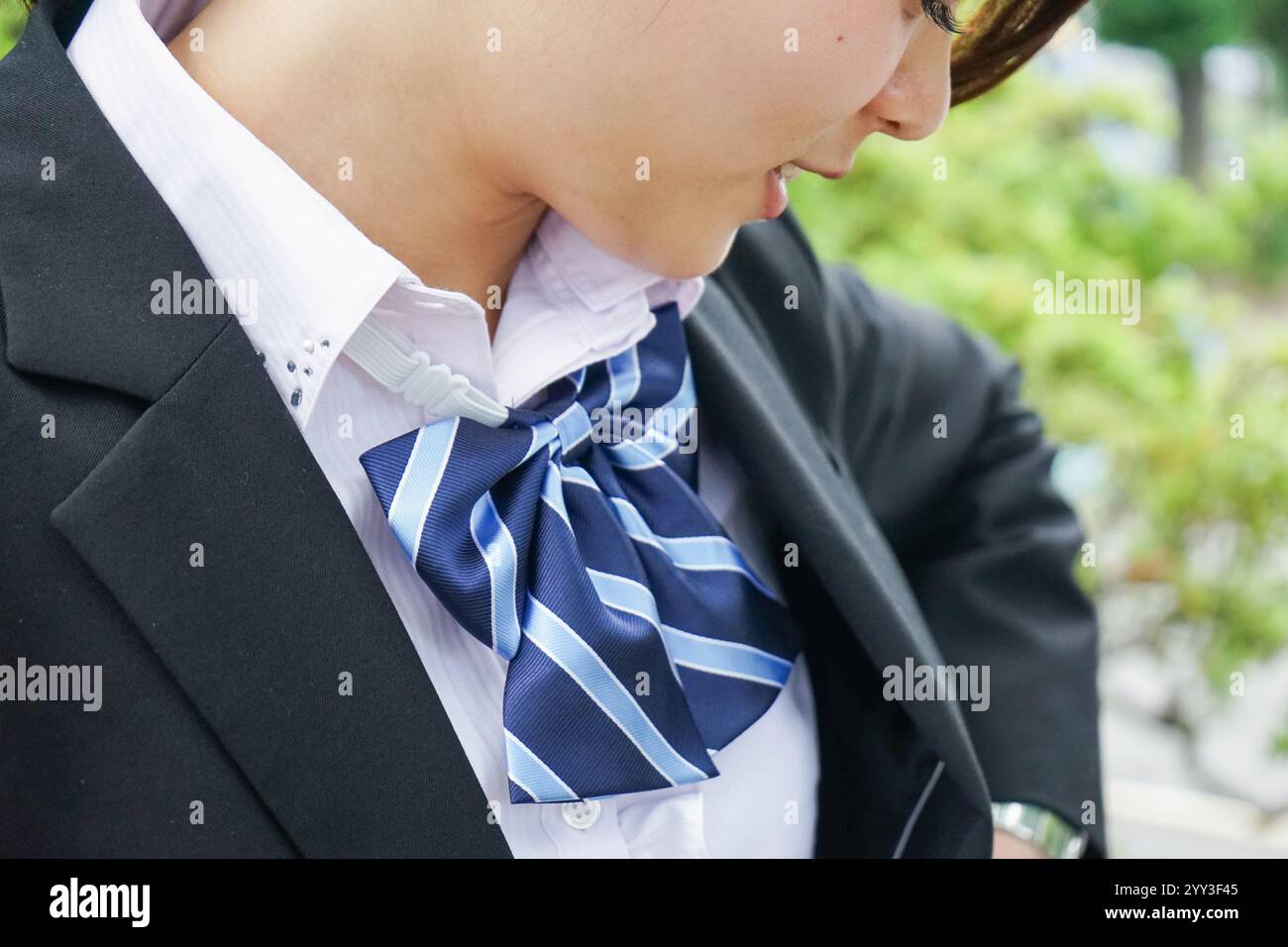 Young students adjusting their uniforms Stock Photo - Alamy