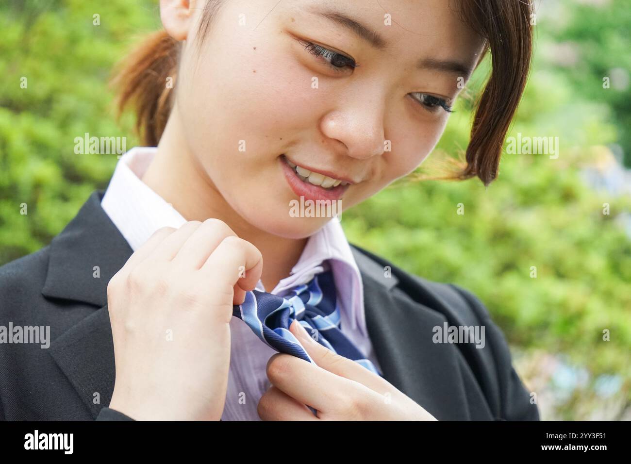 Young students adjusting their uniforms Stock Photo - Alamy
