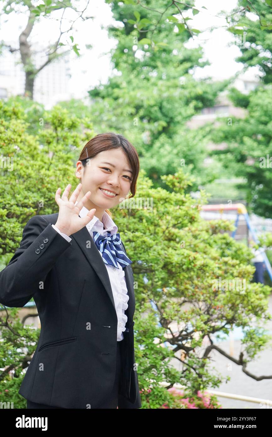 College student waving hand hi-res stock photography and images - Alamy