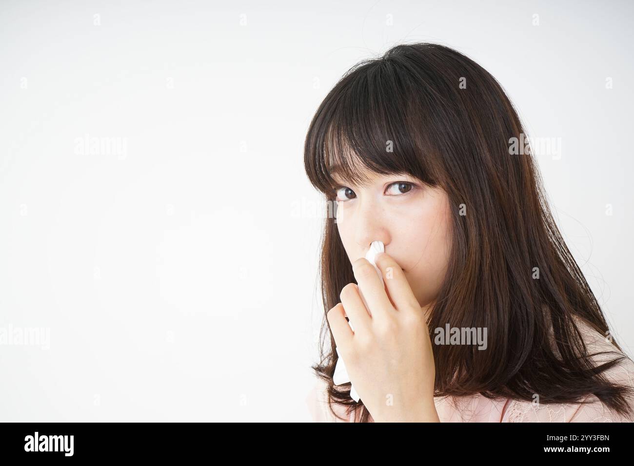 Young woman with bloody nose Stock Photo - Alamy