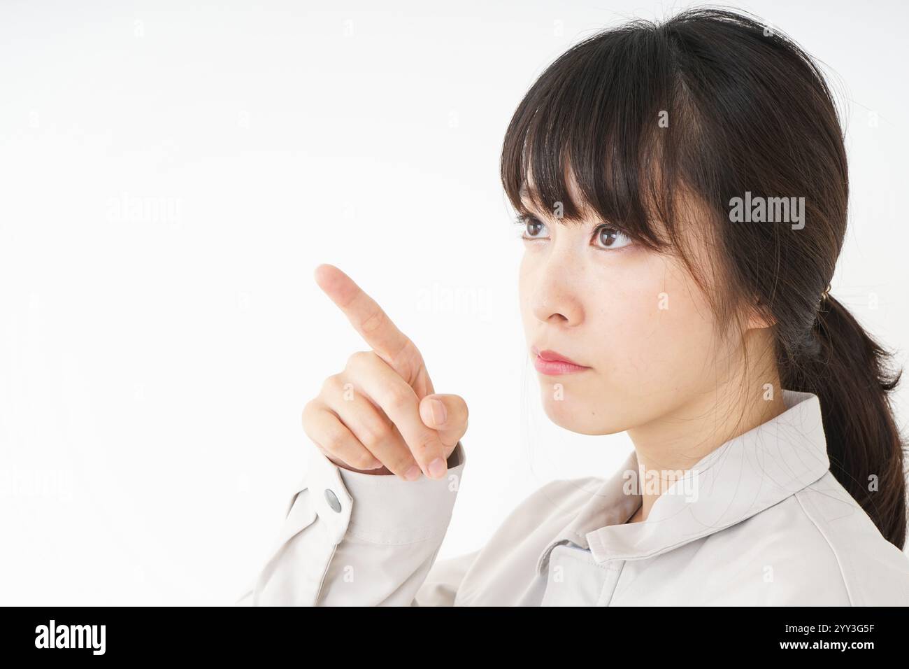 Young woman in work clothes checking for safety Stock Photo - Alamy