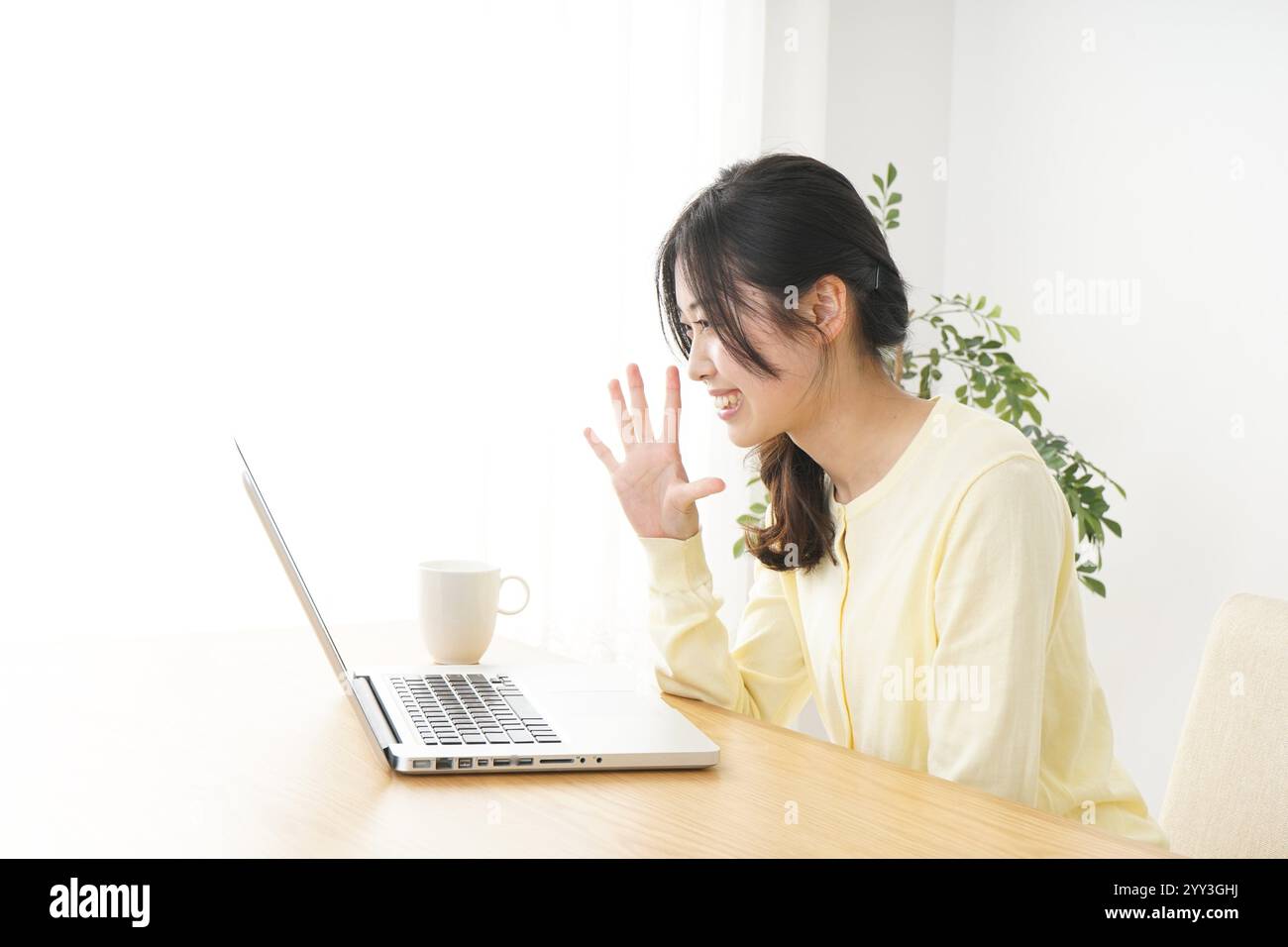 Young woman making a sns/video phone call Stock Photo - Alamy