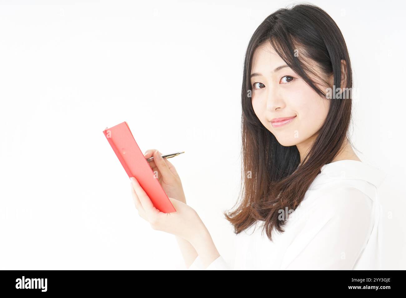 Young woman taking notes Stock Photo - Alamy