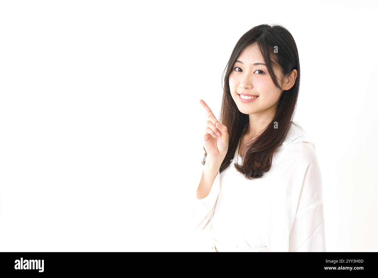 Young woman pointing to point Stock Photo - Alamy