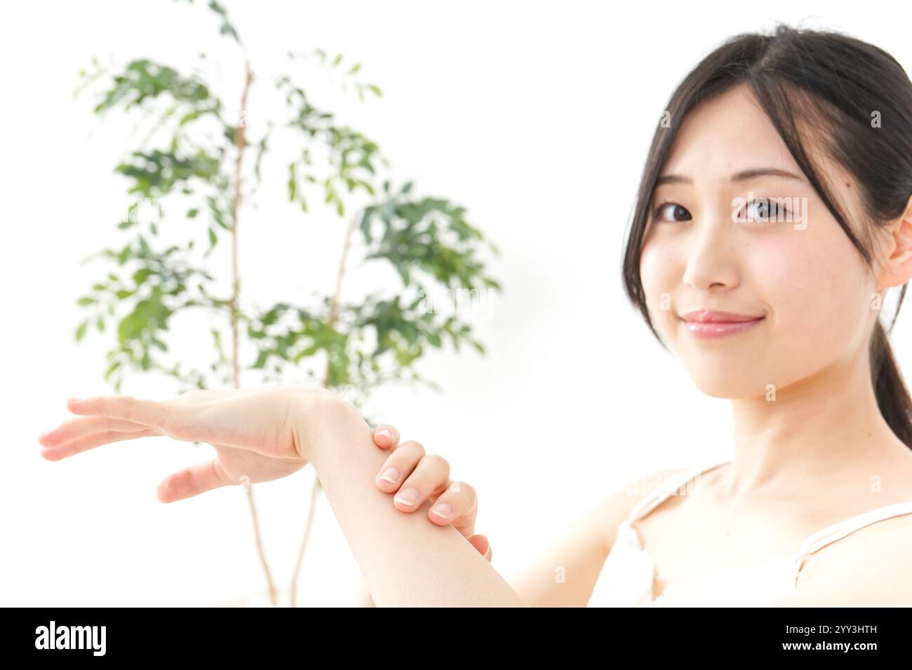 Woman applying hand cream Stock Photo - Alamy