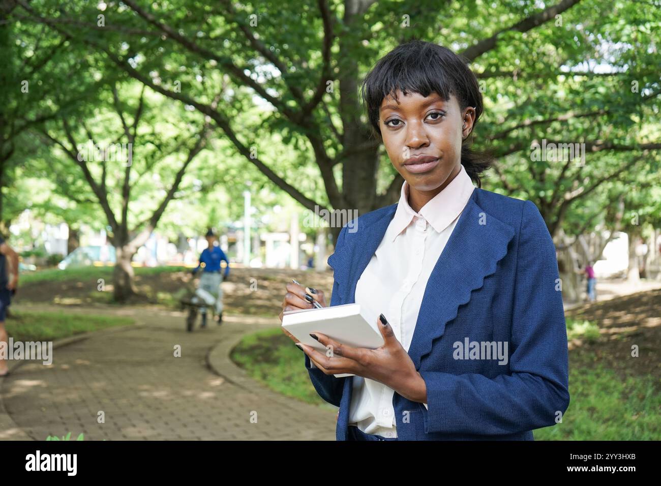 Woman taking notes Stock Photo - Alamy