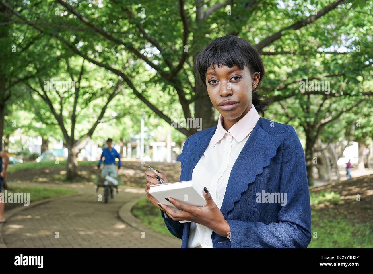 Woman taking notes Stock Photo - Alamy