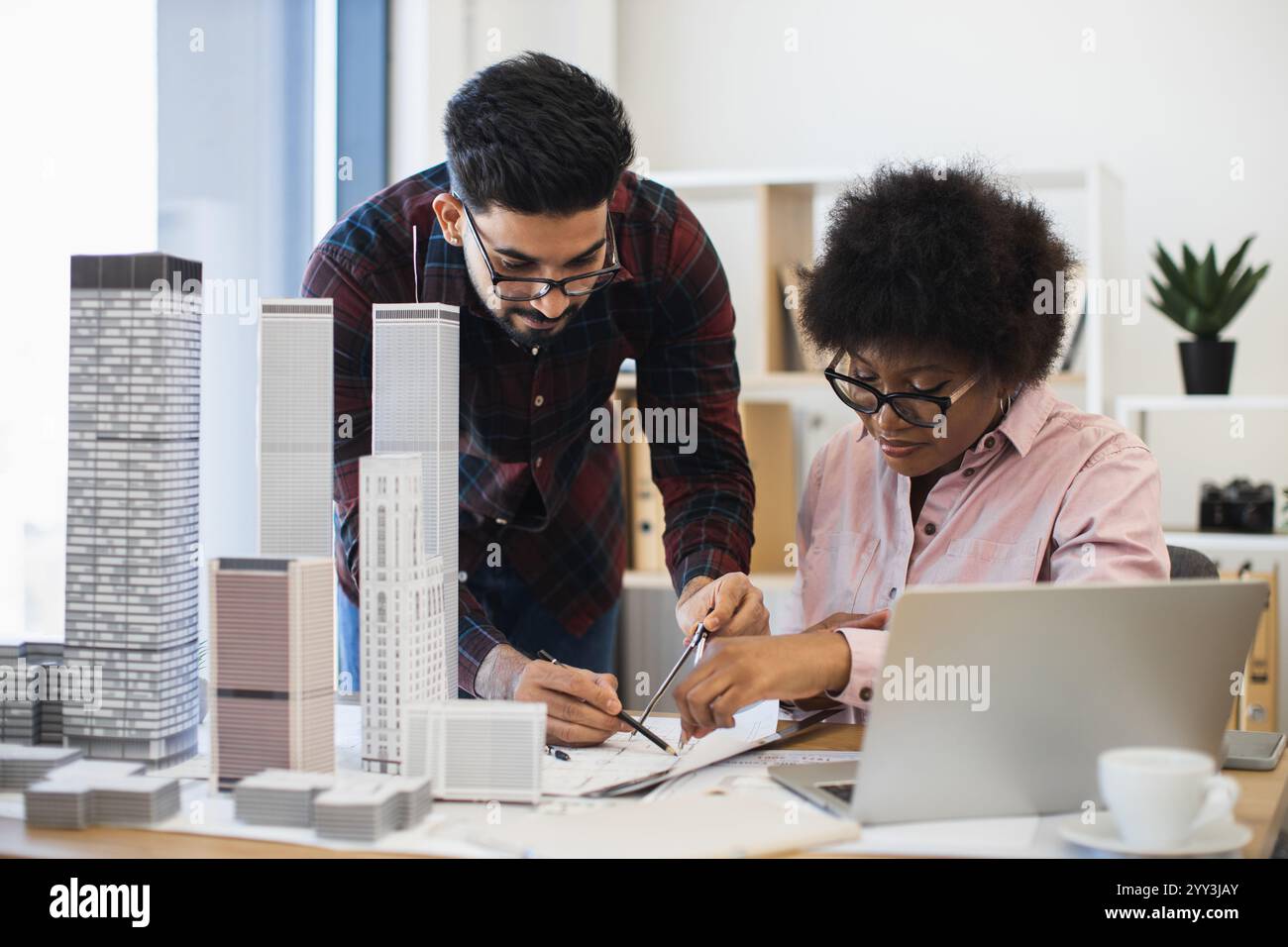 Indian man and African woman architects develop project for modern city ...