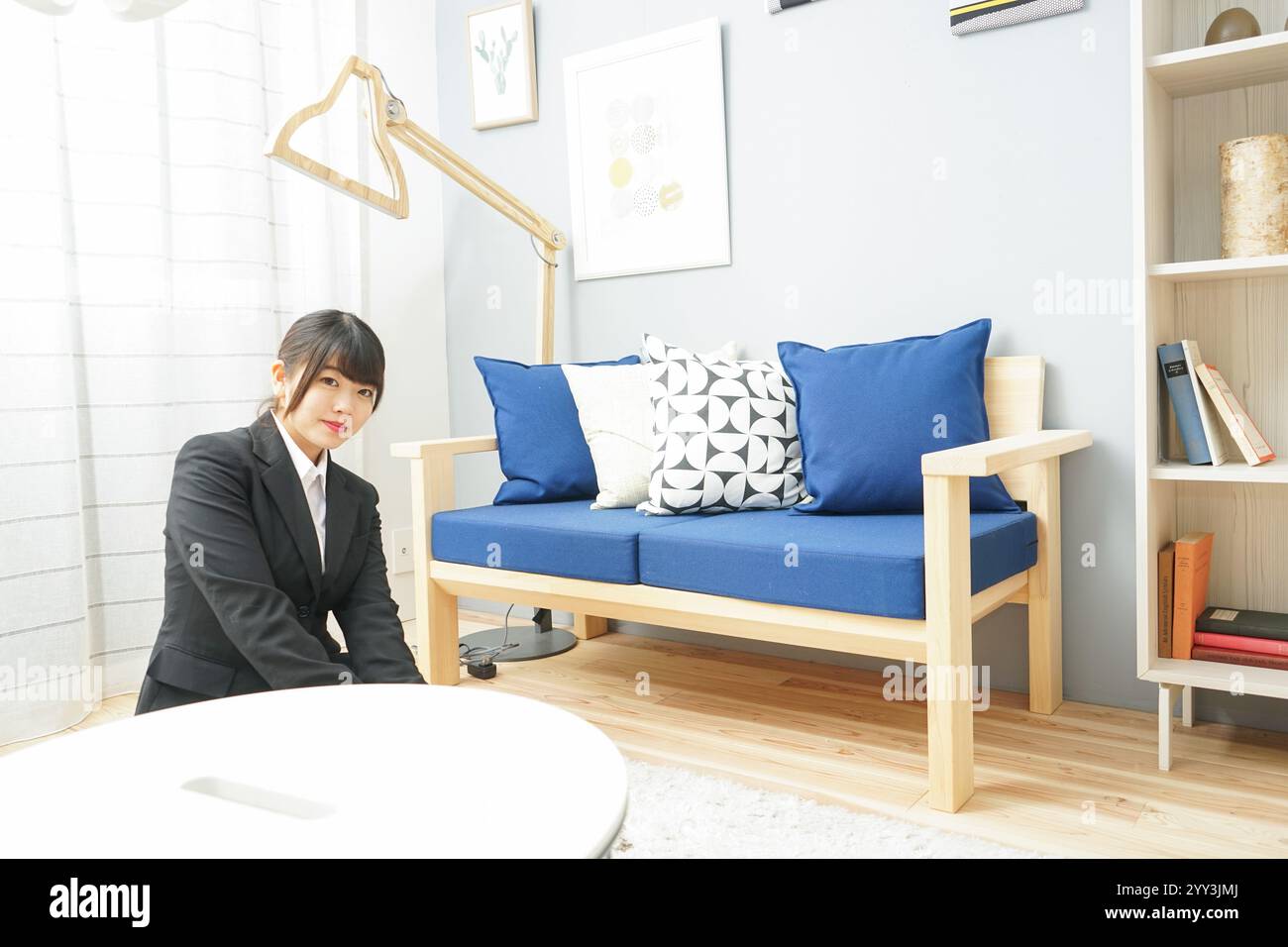 Woman relaxing in a suit Stock Photo - Alamy