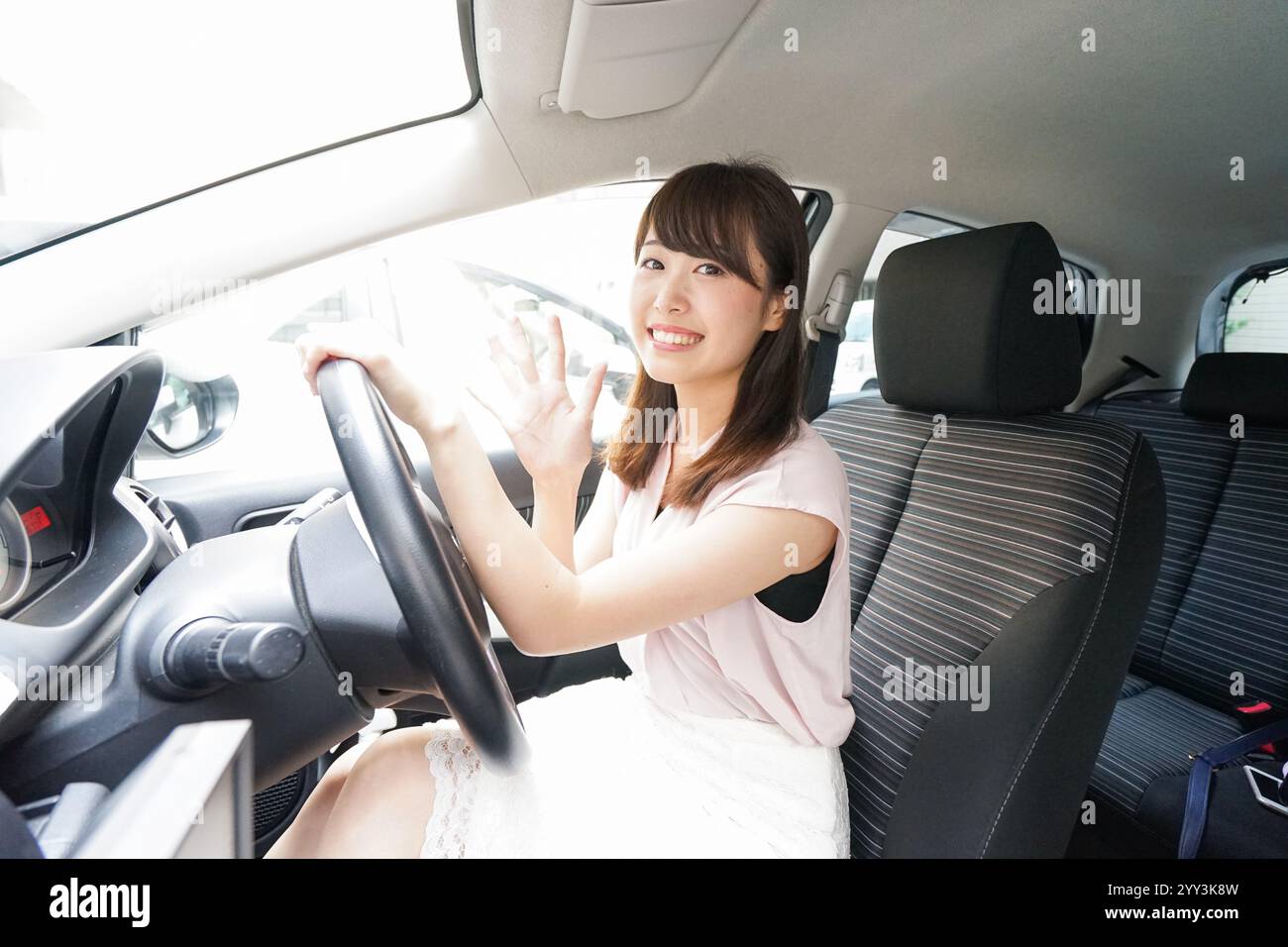 Young Japanese woman driving a car Stock Photo - Alamy