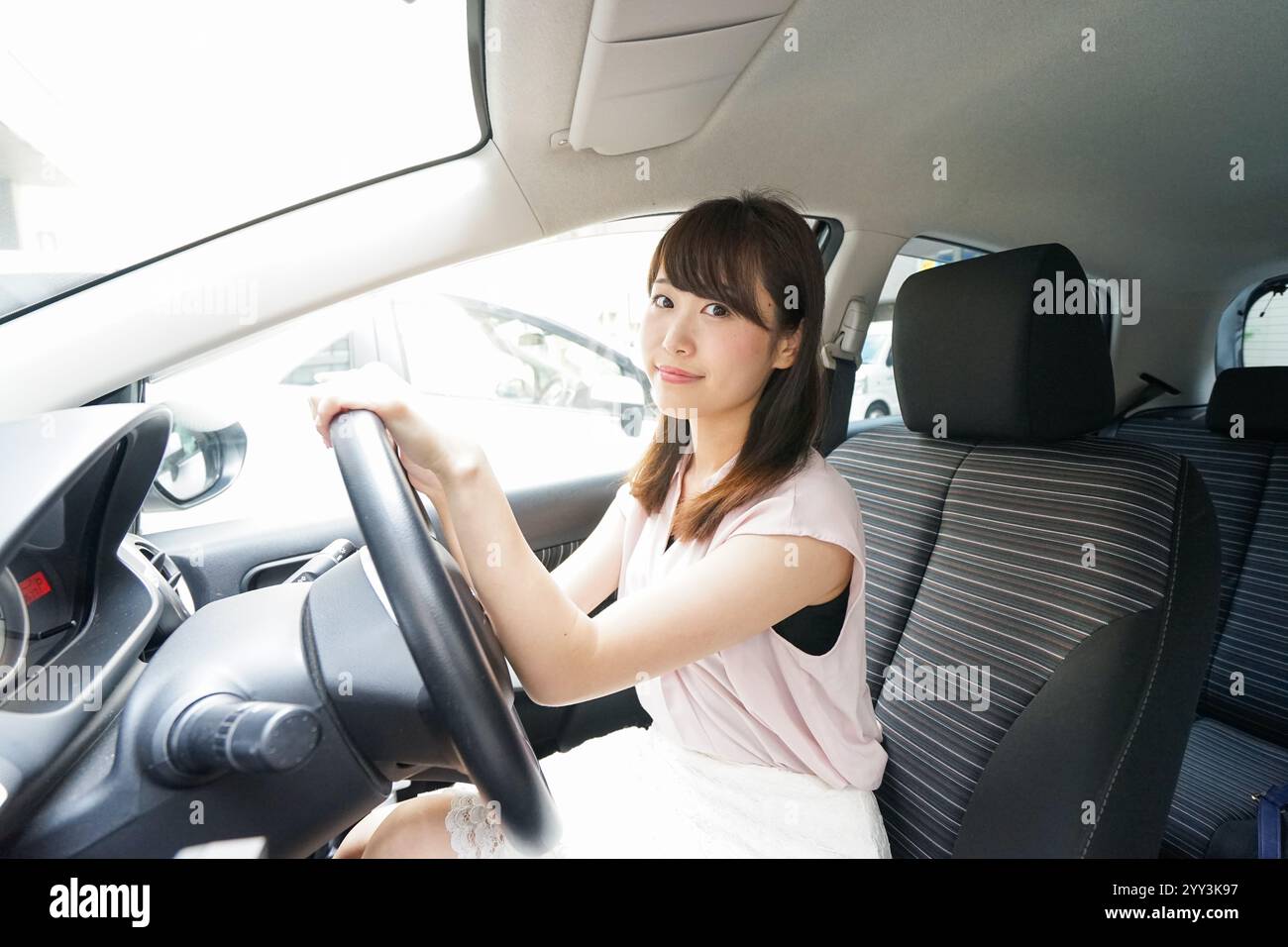 Young Japanese woman driving a car Stock Photo - Alamy