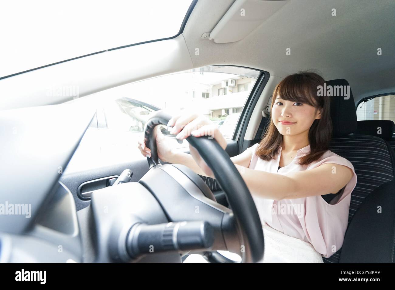 Young Japanese woman driving a car Stock Photo - Alamy