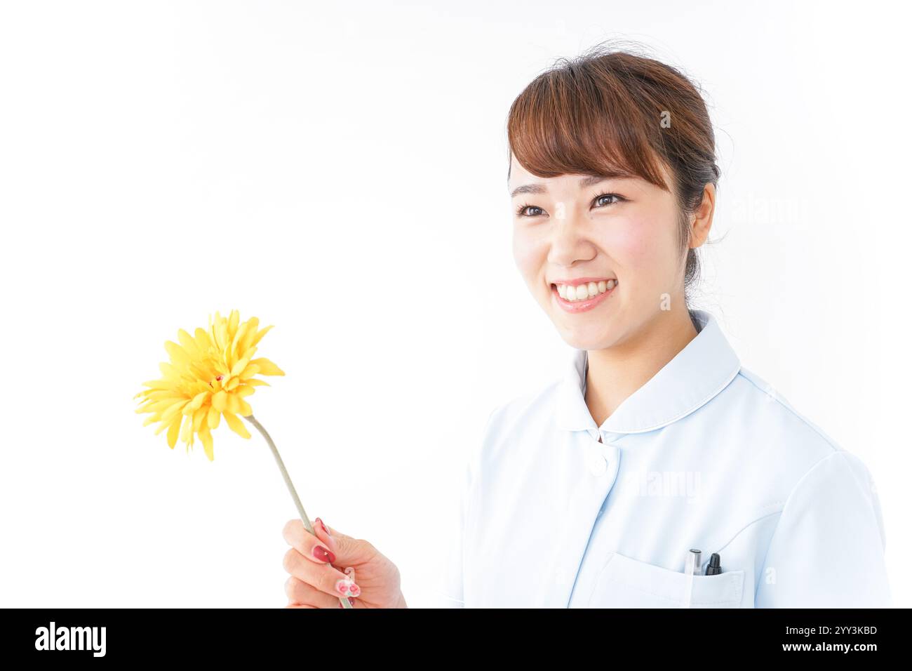 Nurse holding flowers Stock Photo - Alamy