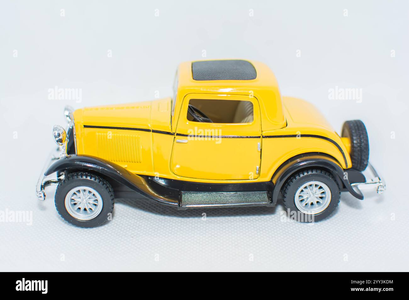 Retro car from the side. Beautiful classic yellow car. Nice antique ...