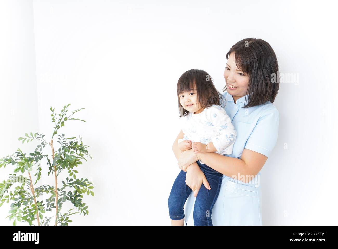 Doctor examining child Cut Out Stock Images & Pictures - Alamy