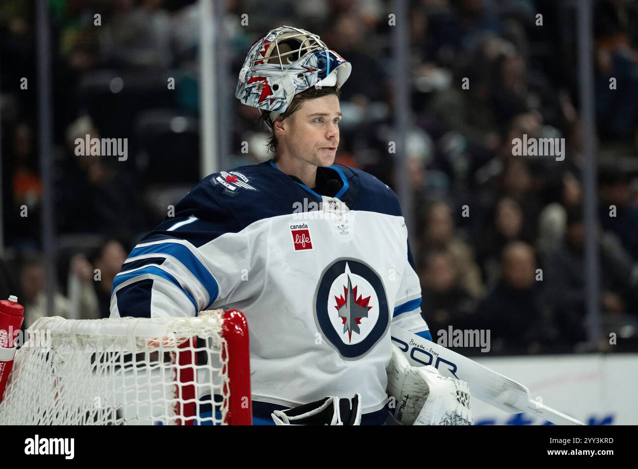 Winnipeg Jets goaltender Eric Comrie (1) takes his stance during an NHL ...