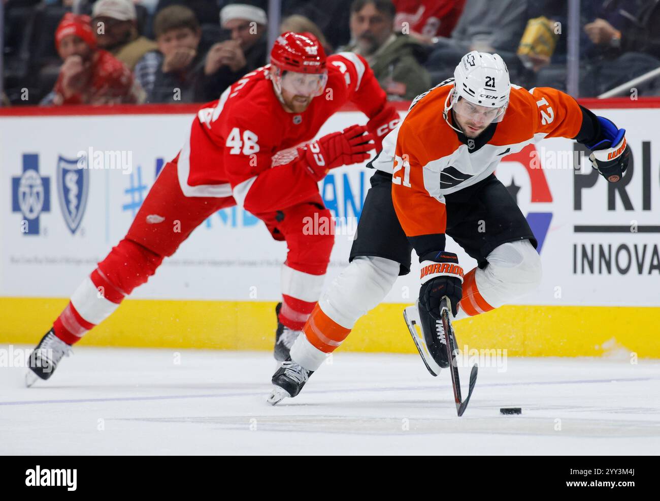 Philadelphia Flyers center Scott Laughton (21) is pursued by Detroit ...