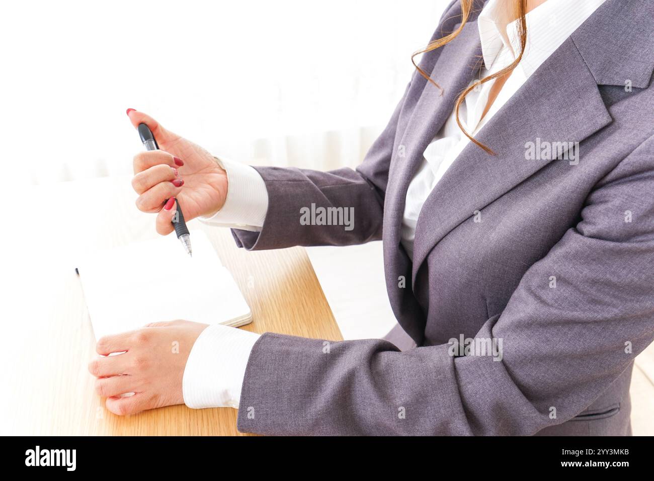 Business woman taking notes Stock Photo - Alamy