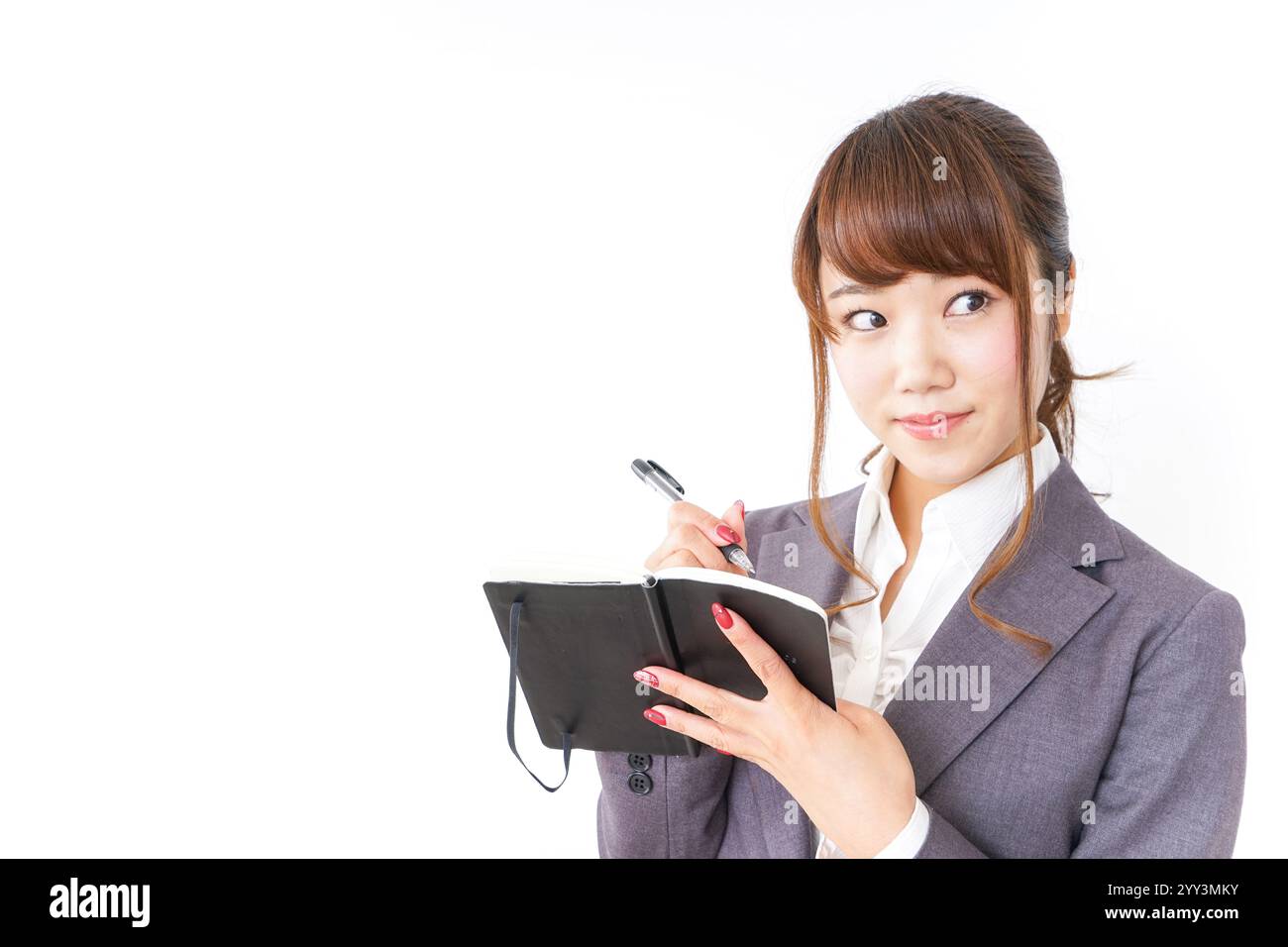 Business woman taking notes Stock Photo - Alamy