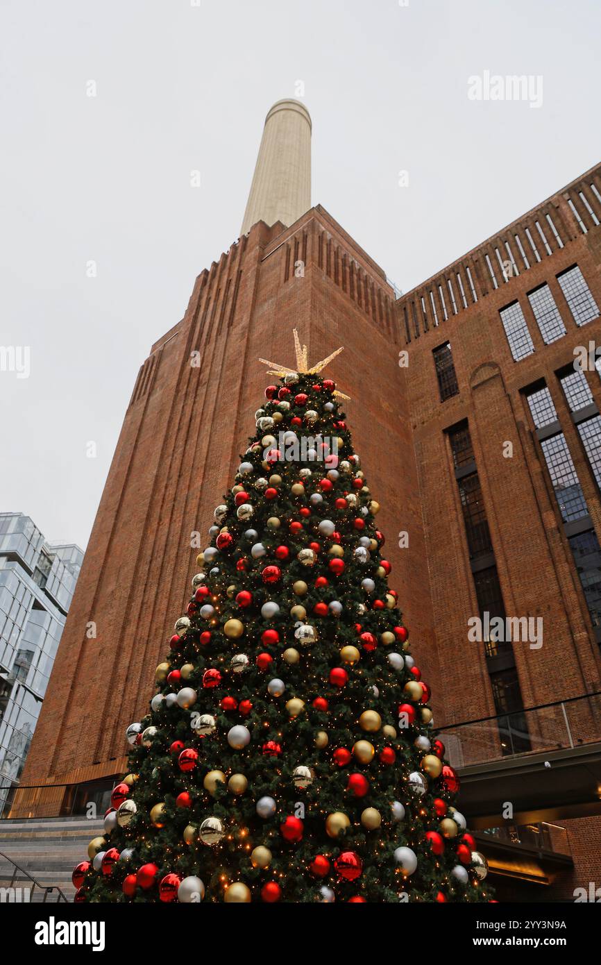 Christmas tree and south facade of Battersea Power Station London UK ...