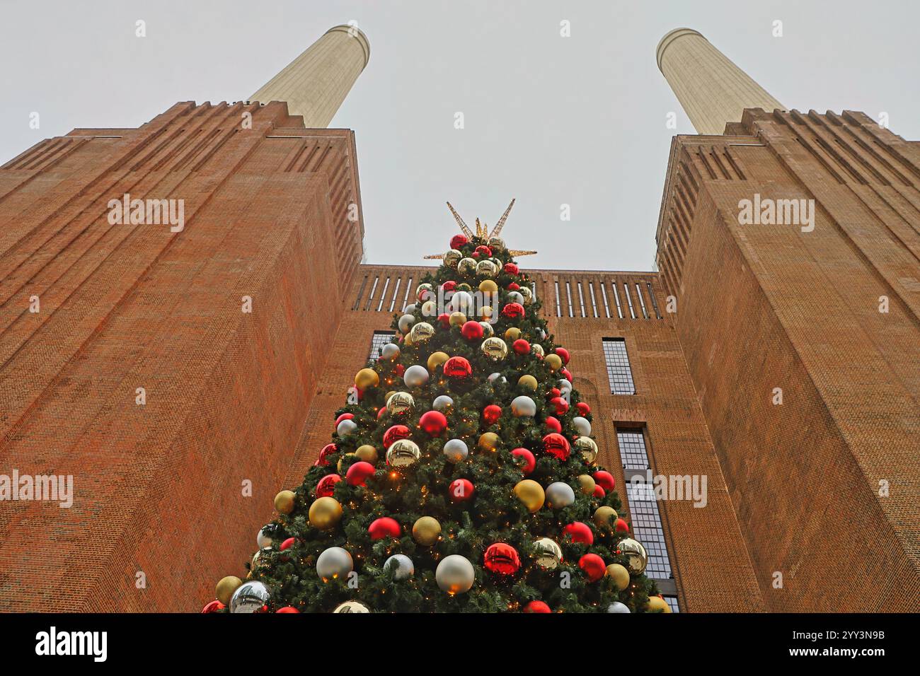 Christmas tree and south facade of Battersea Power Station London UK ...