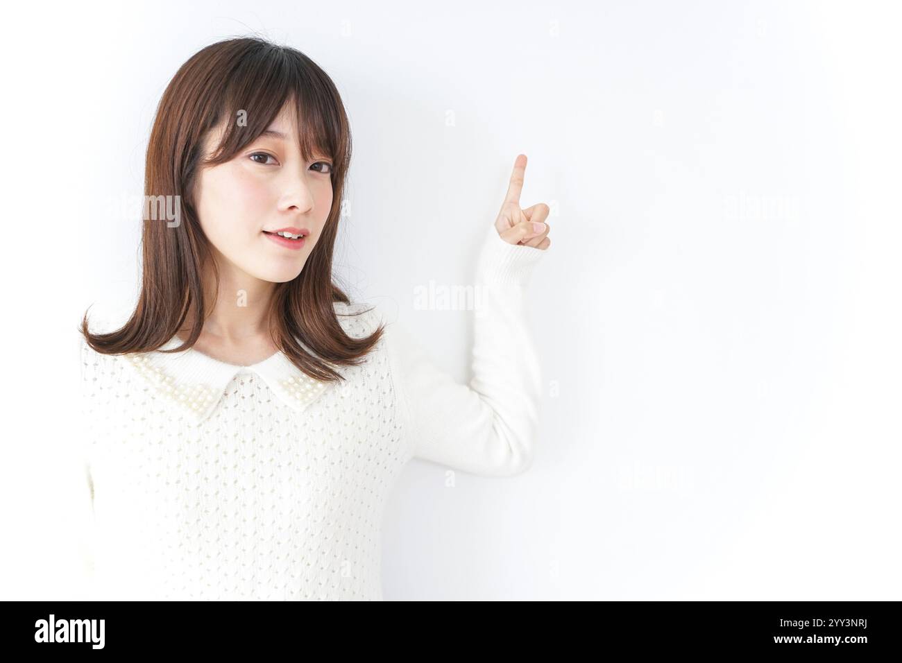 Woman pointing finger Stock Photo - Alamy