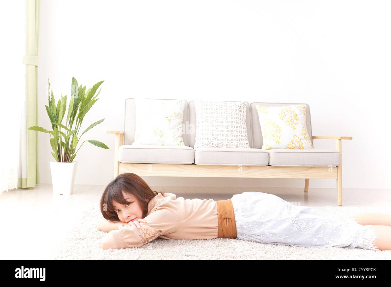 Woman relaxing at home Stock Photo - Alamy
