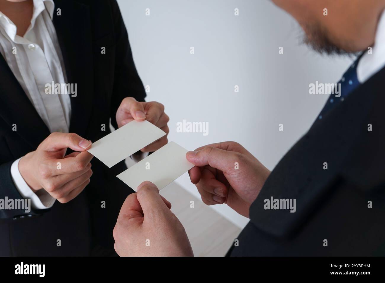 Businessperson exchanging business cards Stock Photo - Alamy