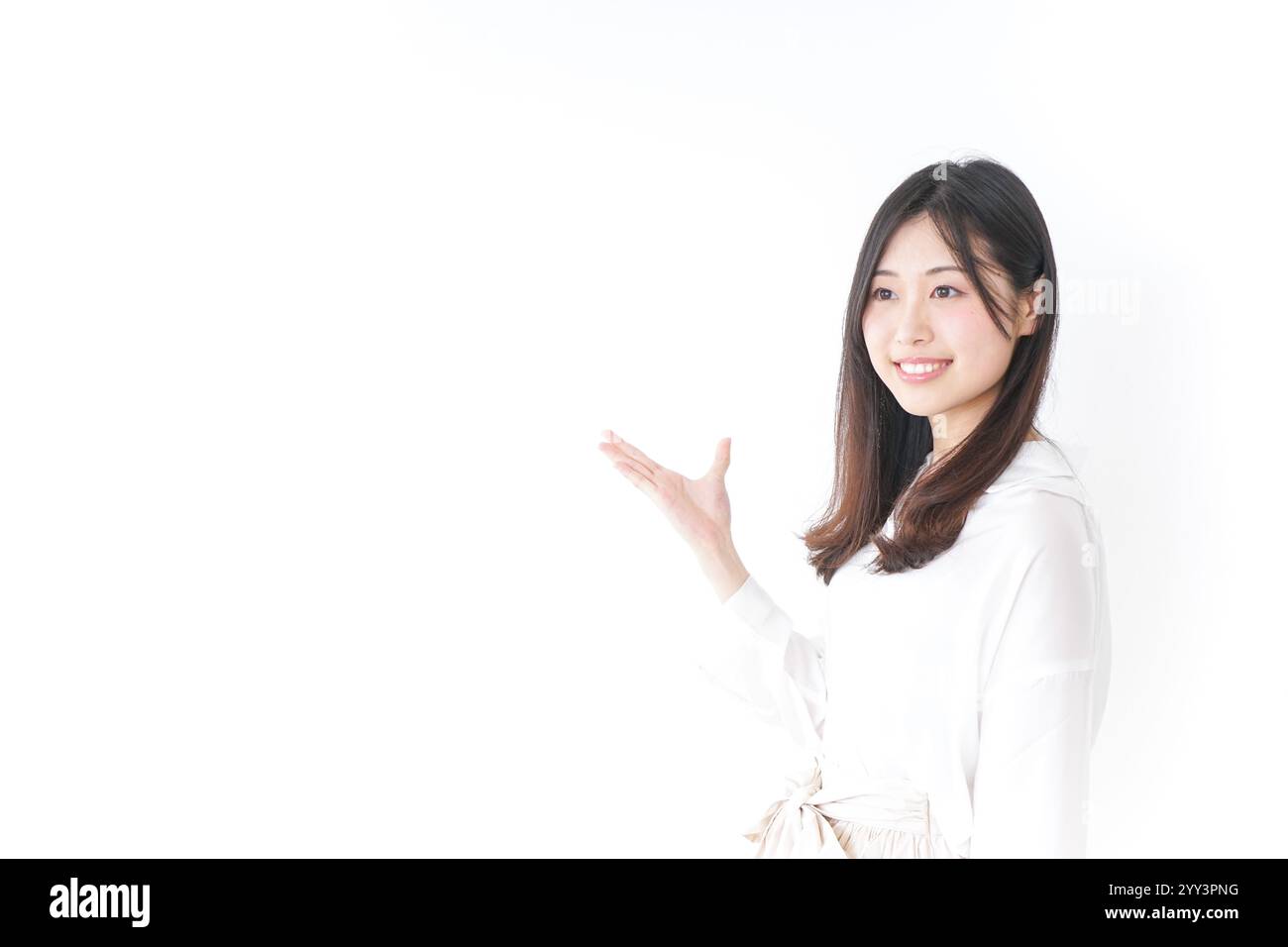 Young woman pointing to point Stock Photo - Alamy