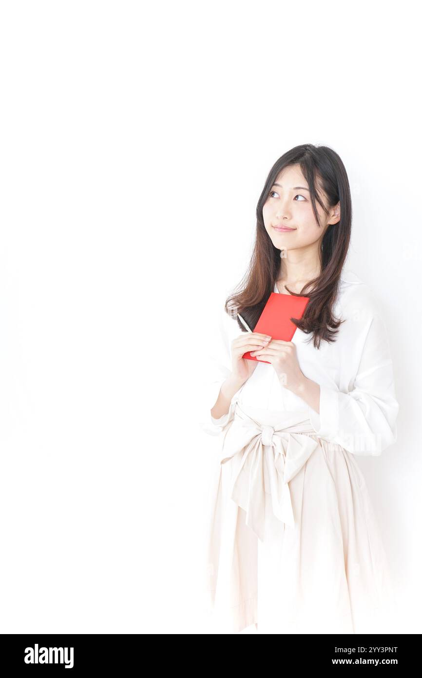 Woman taking notes Stock Photo - Alamy