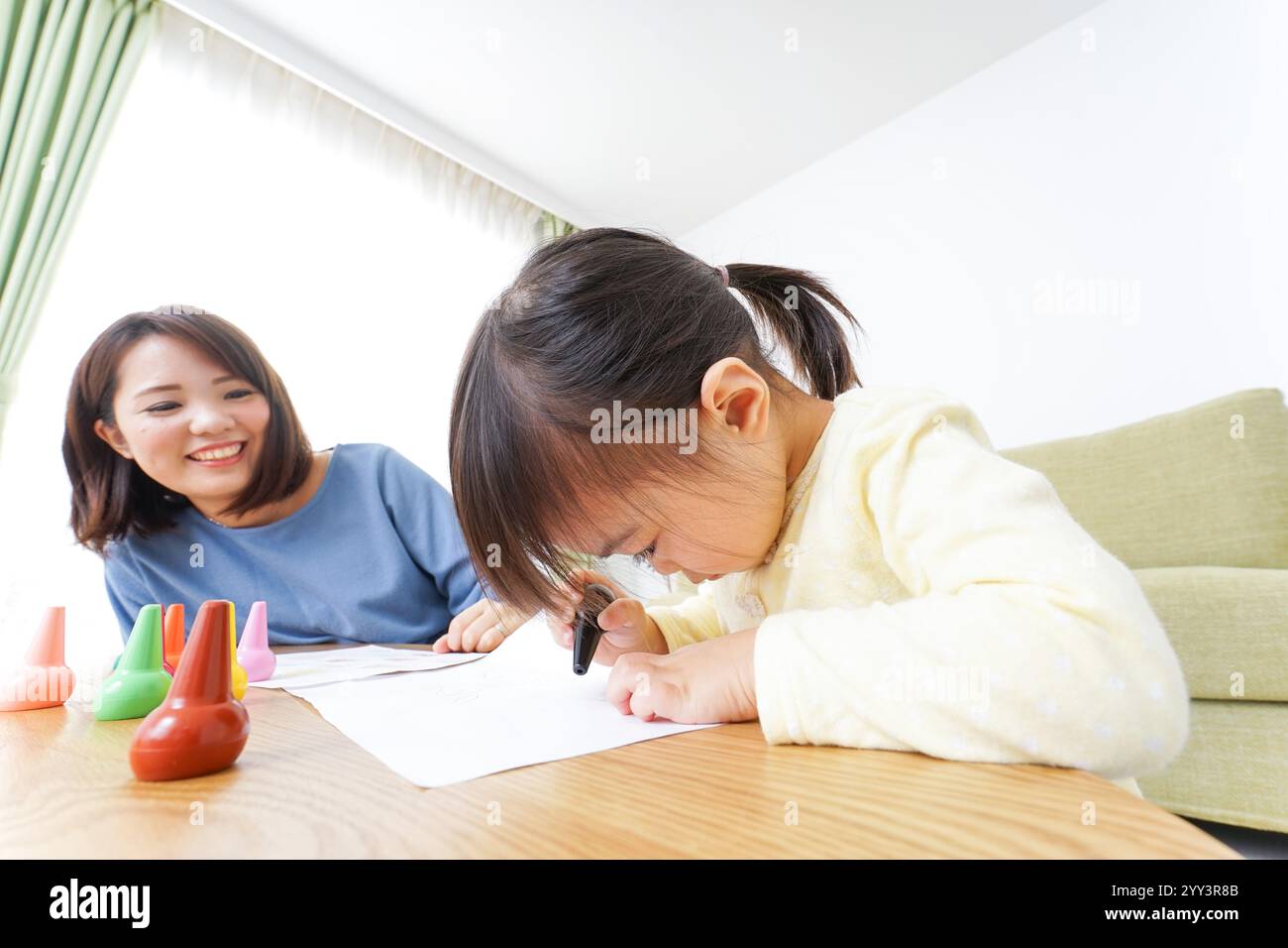 Parent and child drawing Stock Photo - Alamy
