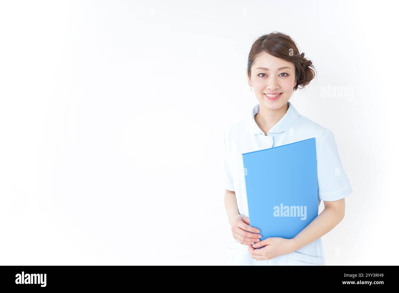Nurse holding papers Stock Photo - Alamy