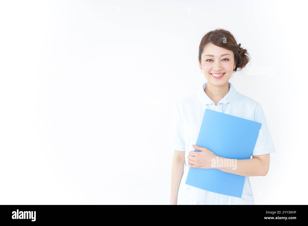 Nurse holding papers Stock Photo - Alamy