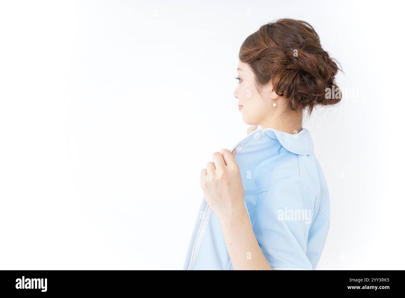 Nurse changing clothes Stock Photo - Alamy