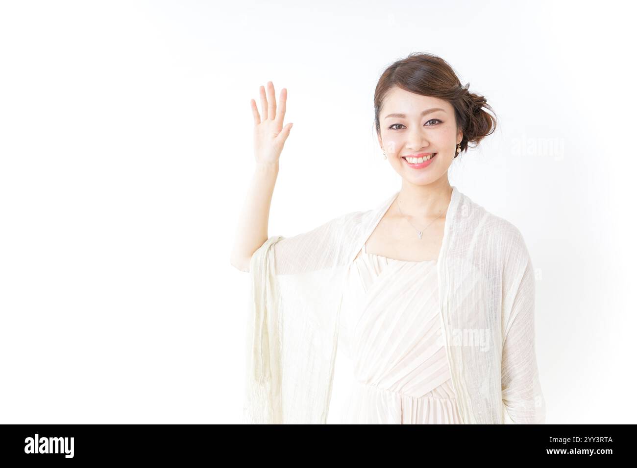Woman in dress waving Stock Photo - Alamy