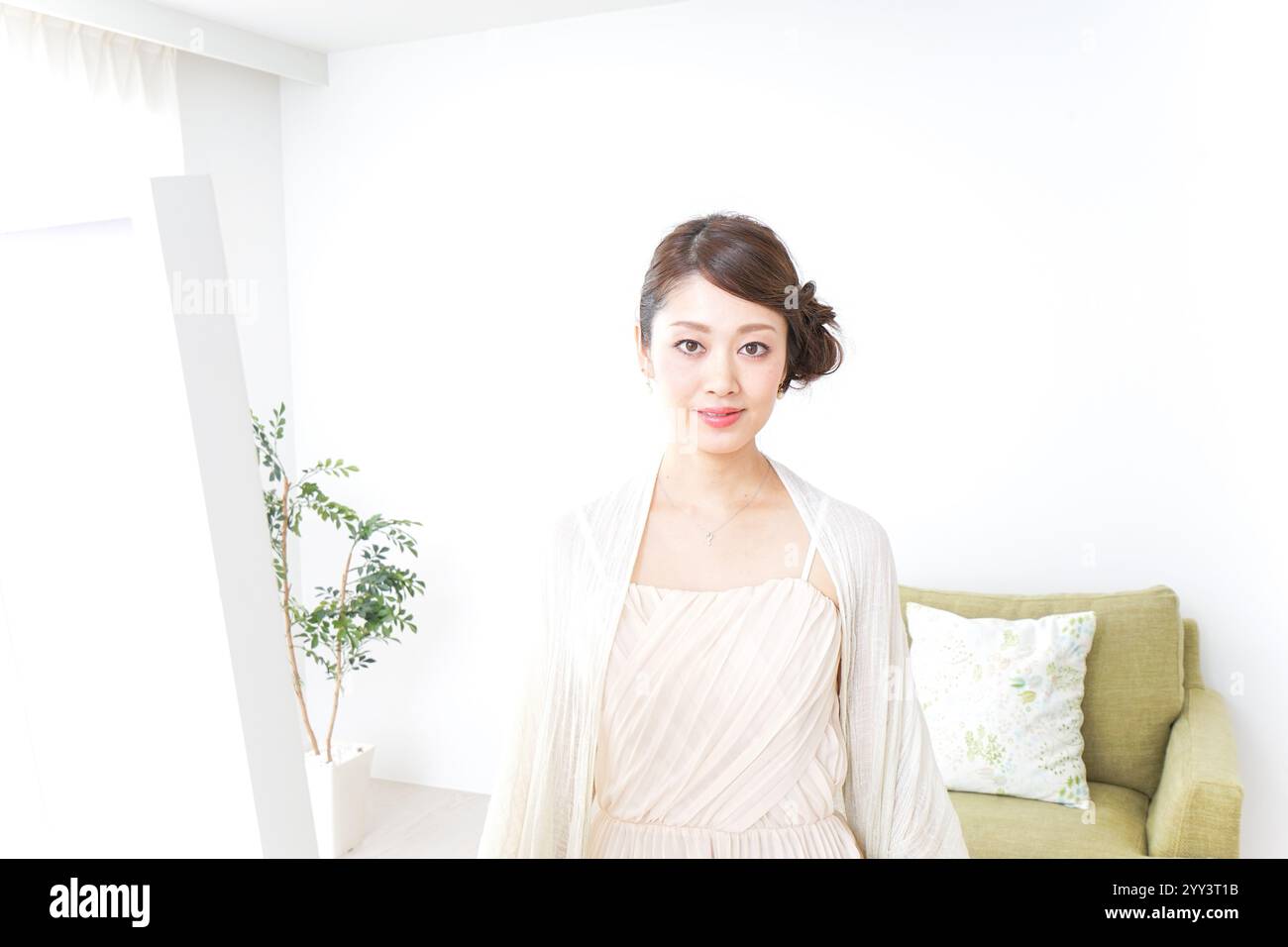 Woman getting ready to go out Stock Photo - Alamy